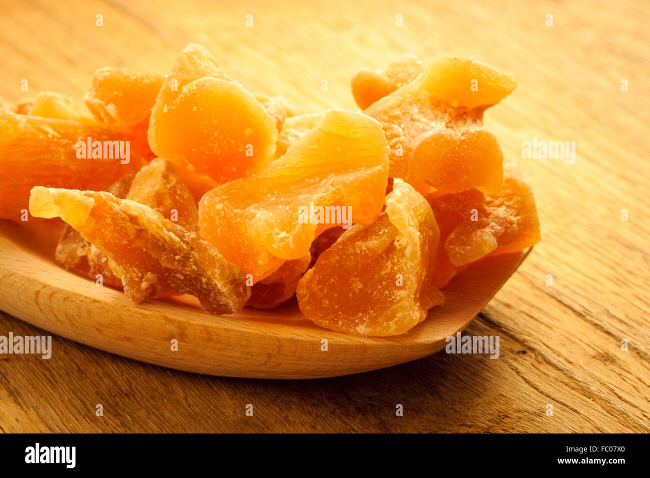 Closeup candied ginger on wooden spoon Stock Photo - Alamy