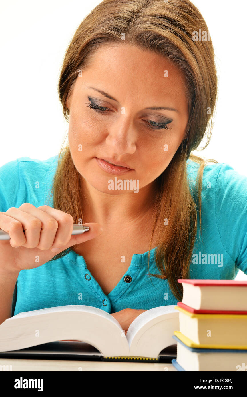 Young woman reading a book. Female student learning Stock Photo - Alamy