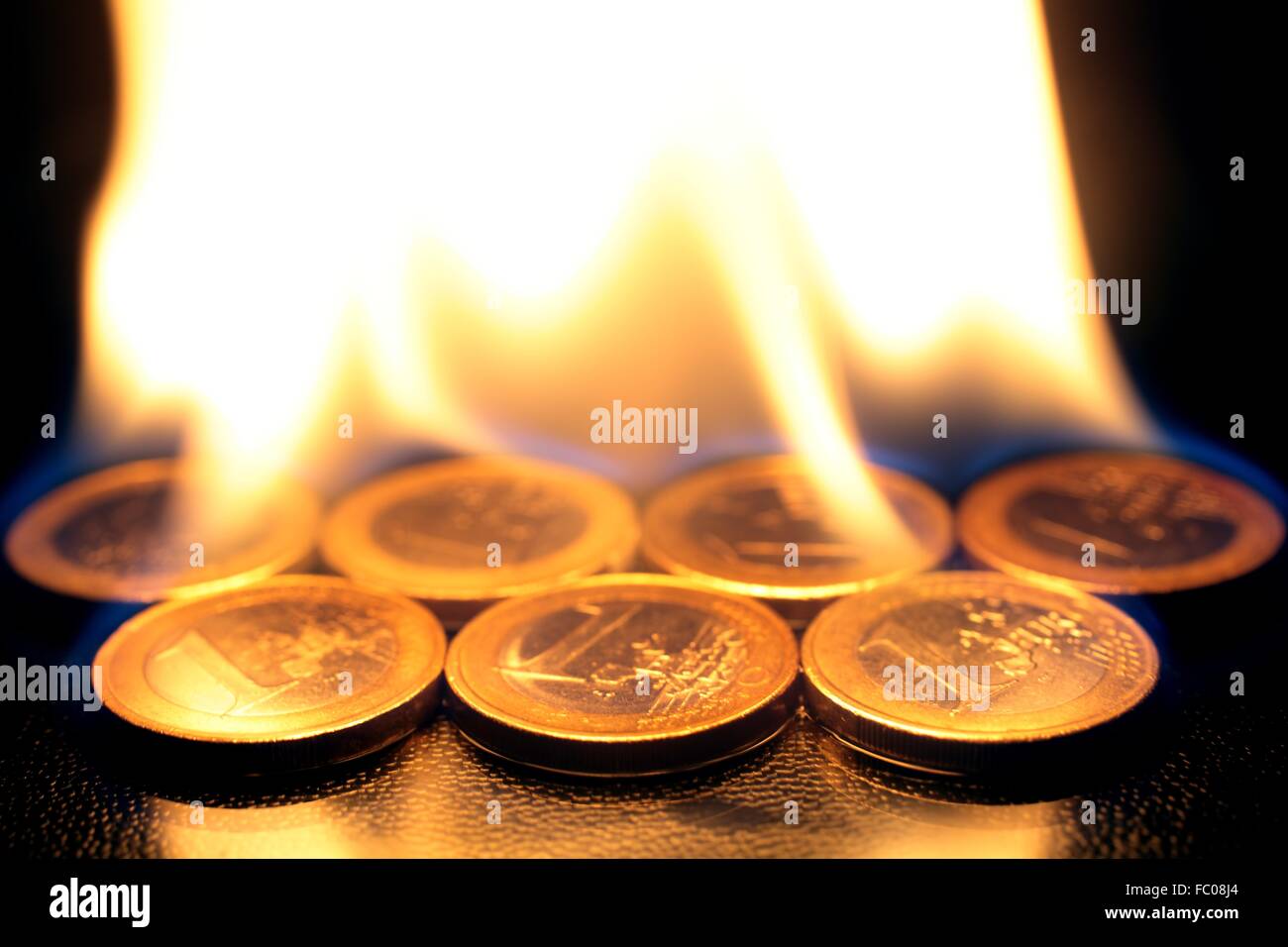 Coin burning hi-res stock photography and images - Alamy