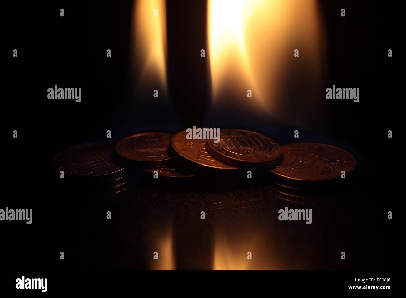 Euro coin burning hi-res stock photography and images - Alamy