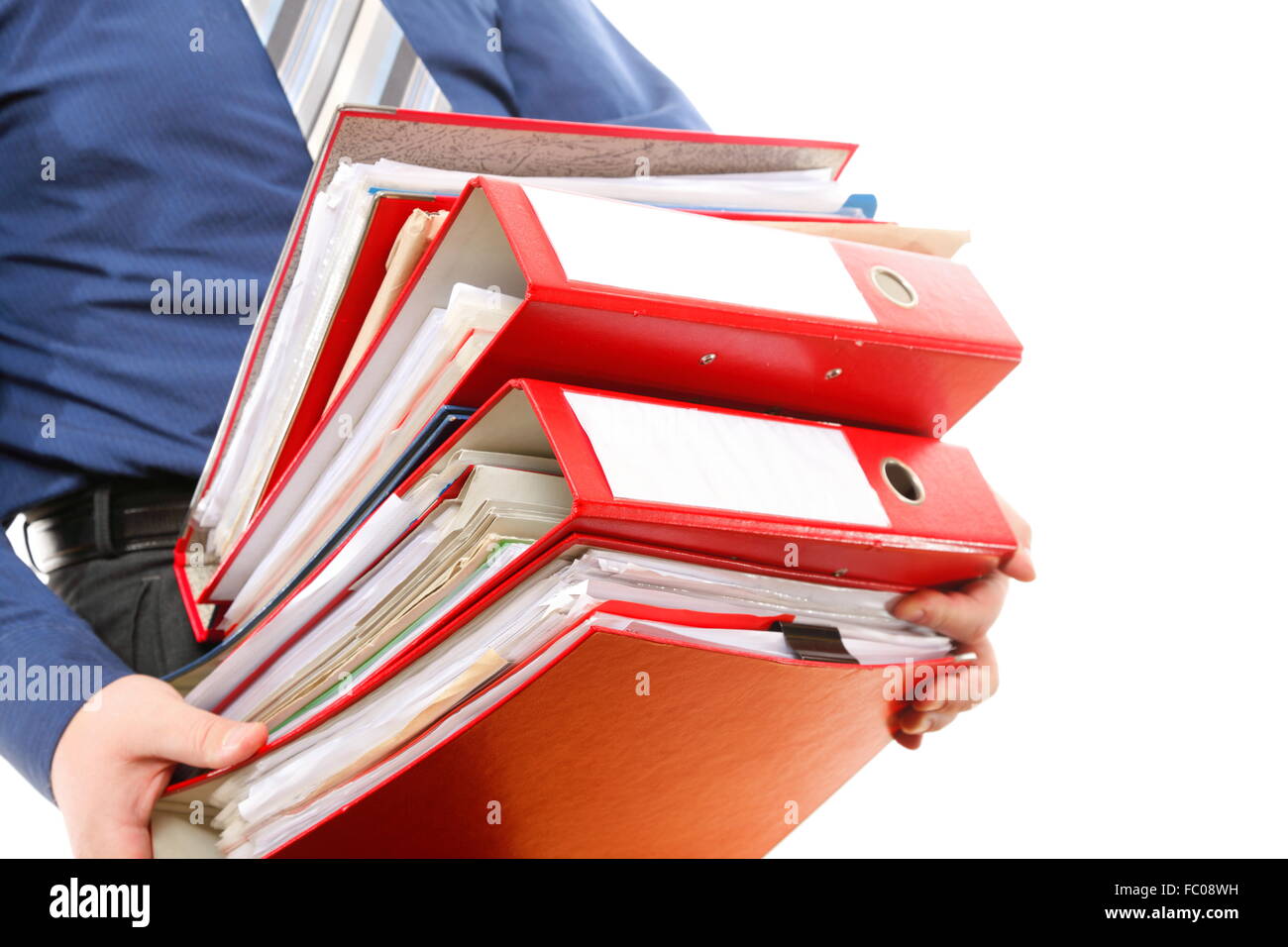 Male office worker carrying a stack of files Stock Photo - Alamy