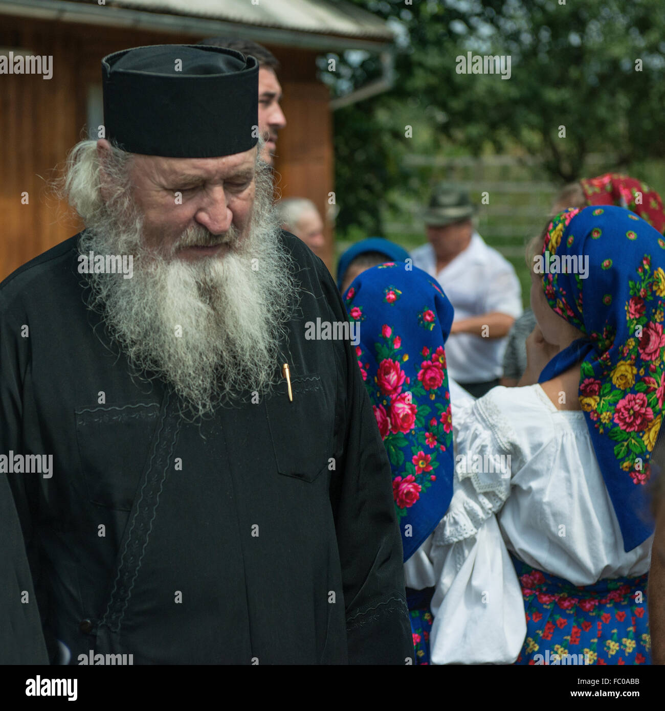 A catholic priest in the Church of "St. Dumitru" in Leud, in the ...