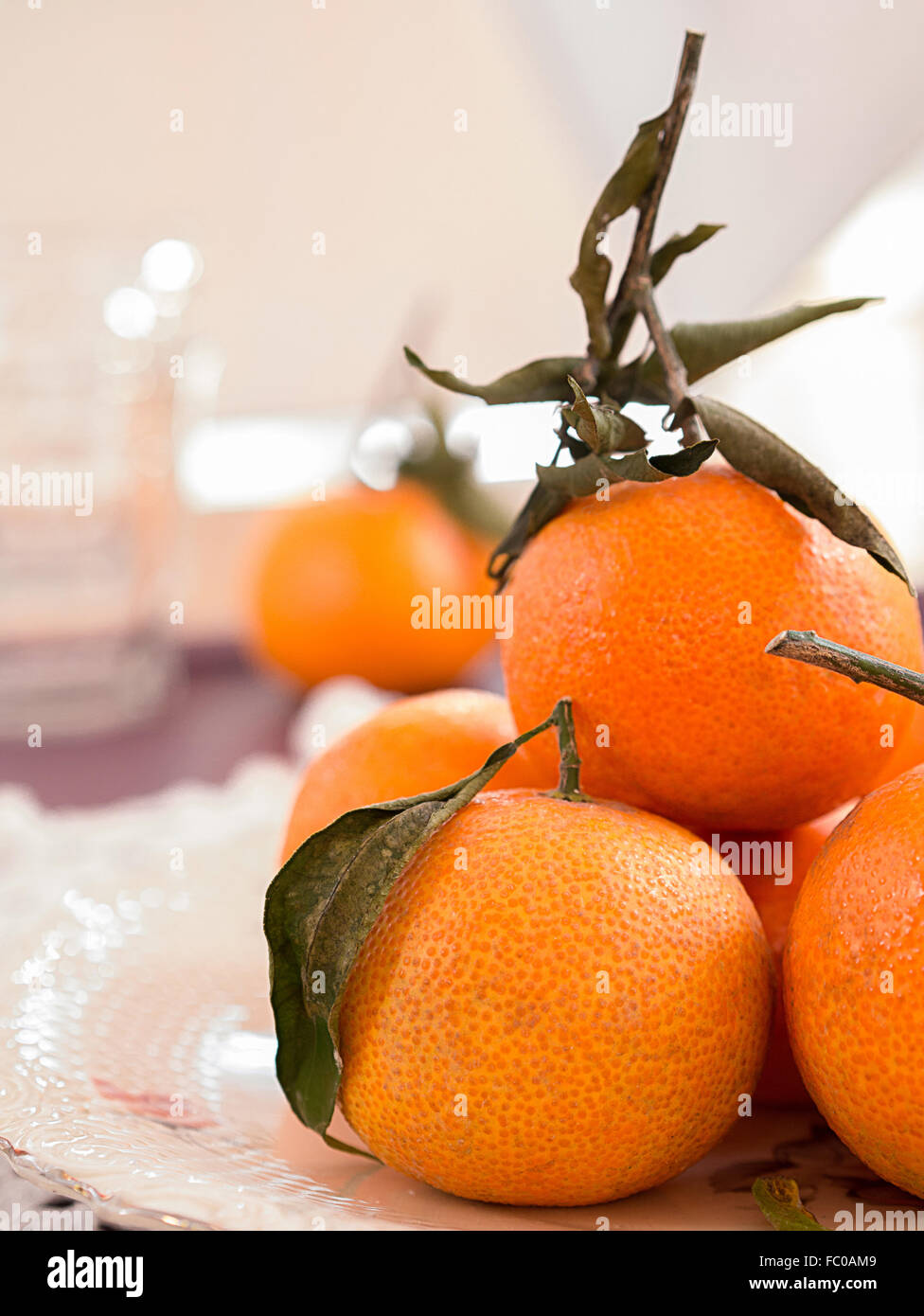 Tangerines on a plate Stock Photo - Alamy