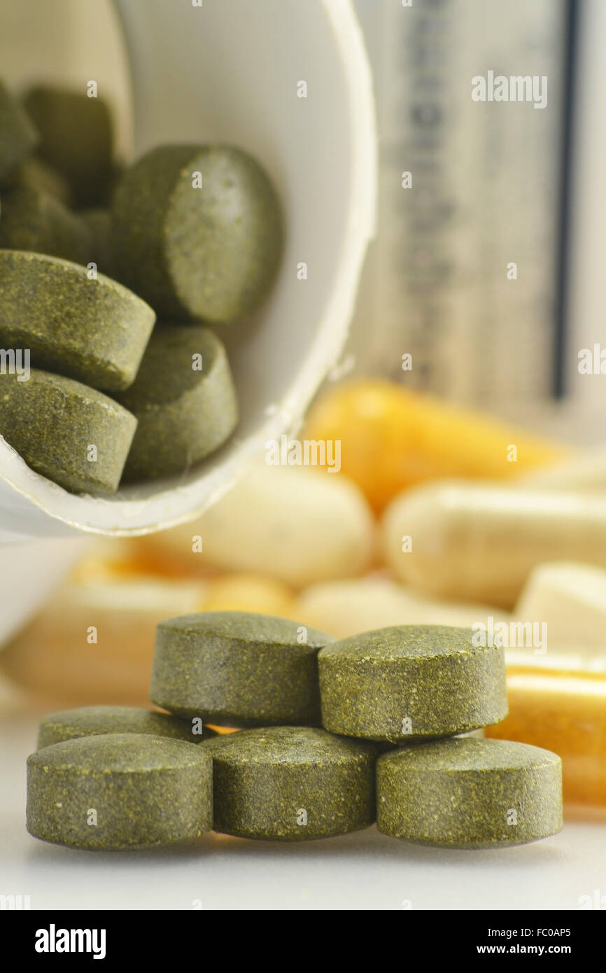 Composition with dietary supplement capsules and containers. Variety of ...