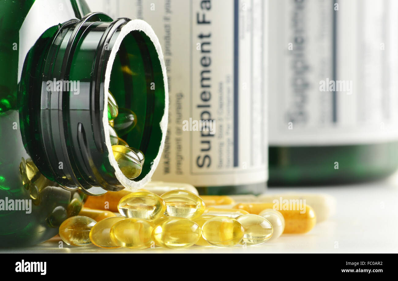 Composition with dietary supplement capsules and containers. Variety of ...