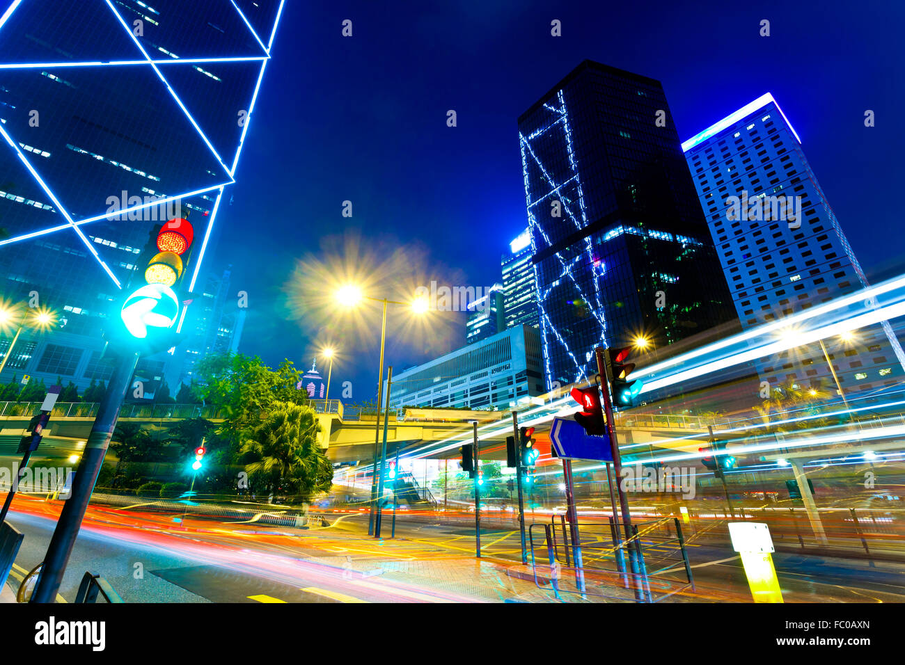 Light trails with modern buildings background Stock Photo - Alamy