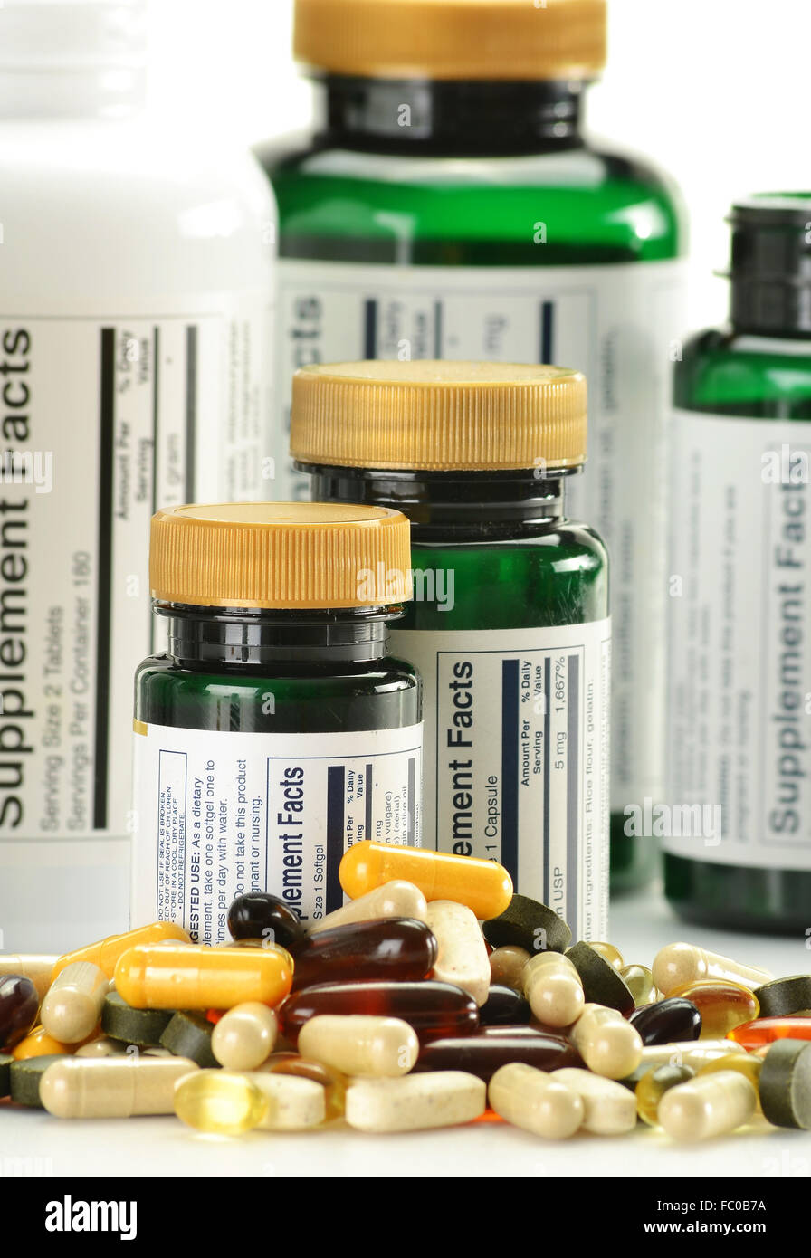 Composition with dietary supplement capsules and containers Stock Photo ...