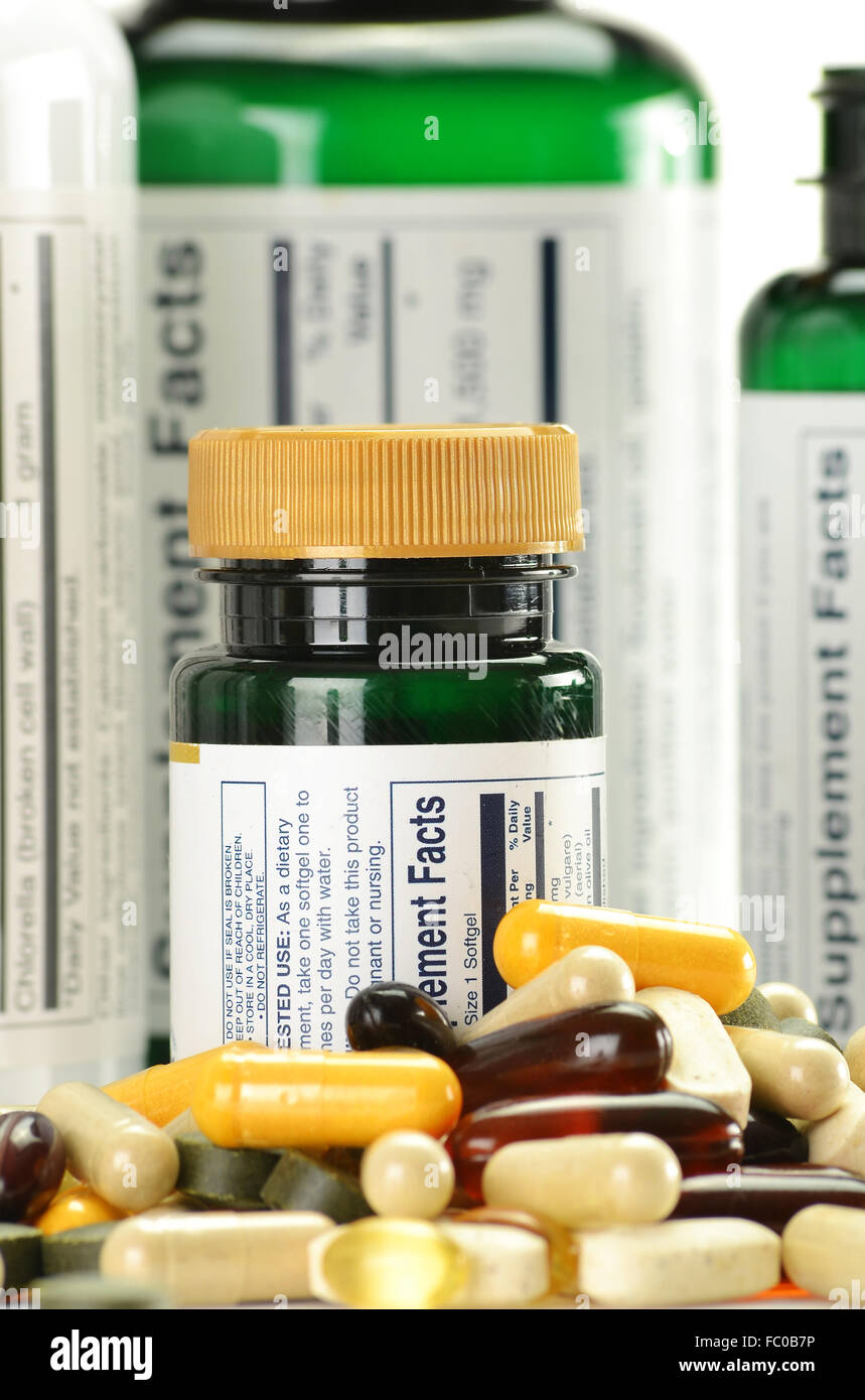 Composition with dietary supplement capsules and containers Stock Photo ...