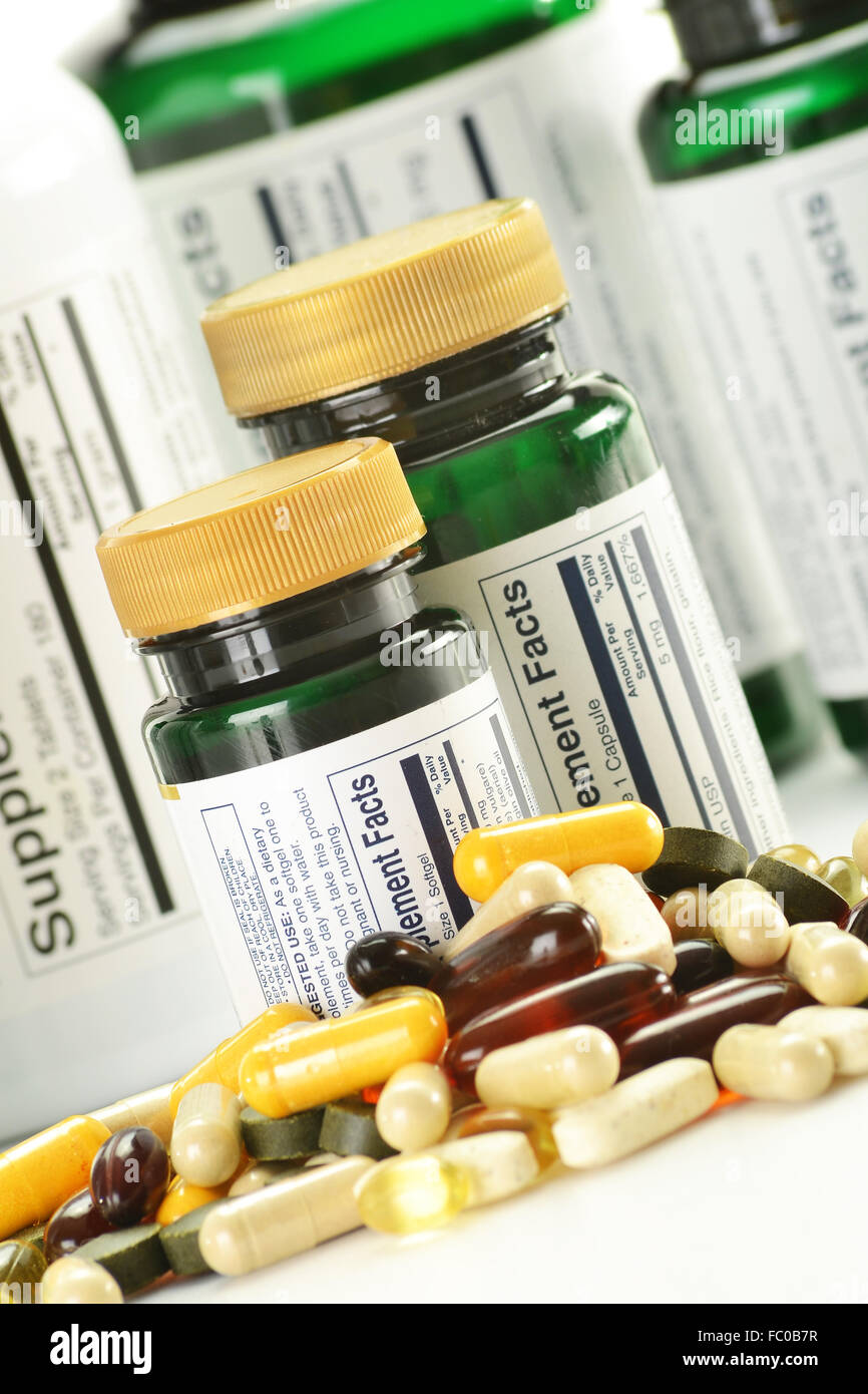 Composition with dietary supplement capsules and containers Stock Photo ...
