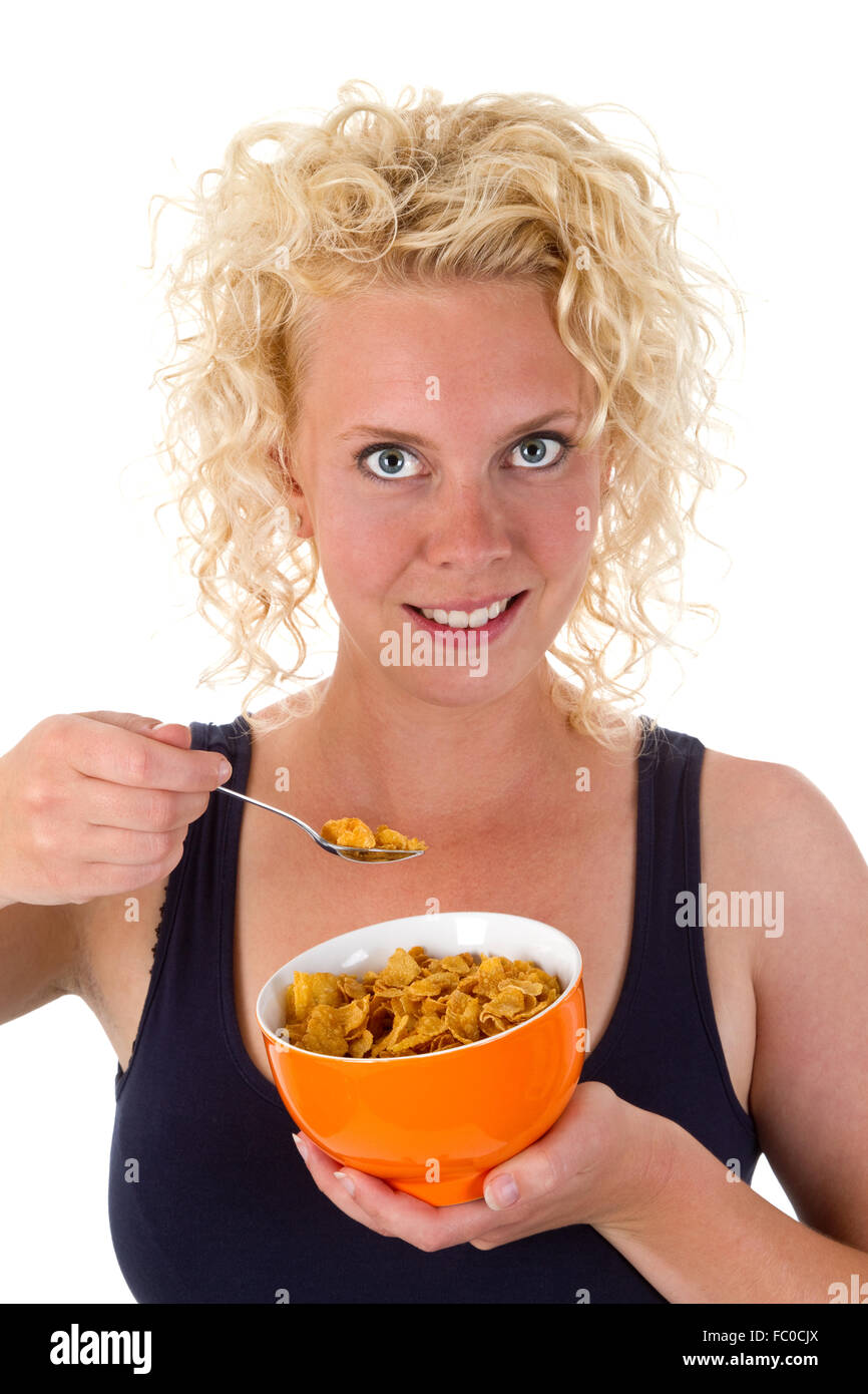 Young woman showing cornflakes Stock Photo - Alamy