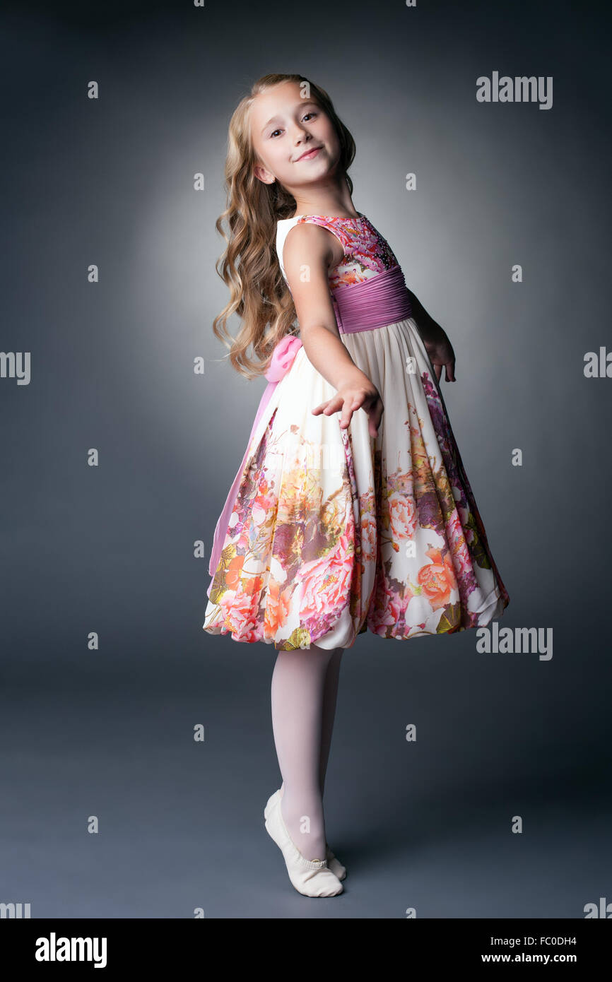 Smiling little dancer posing in studio Stock Photo - Alamy