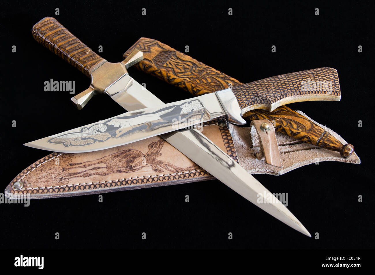 Cold weapon on black background Stock Photo - Alamy