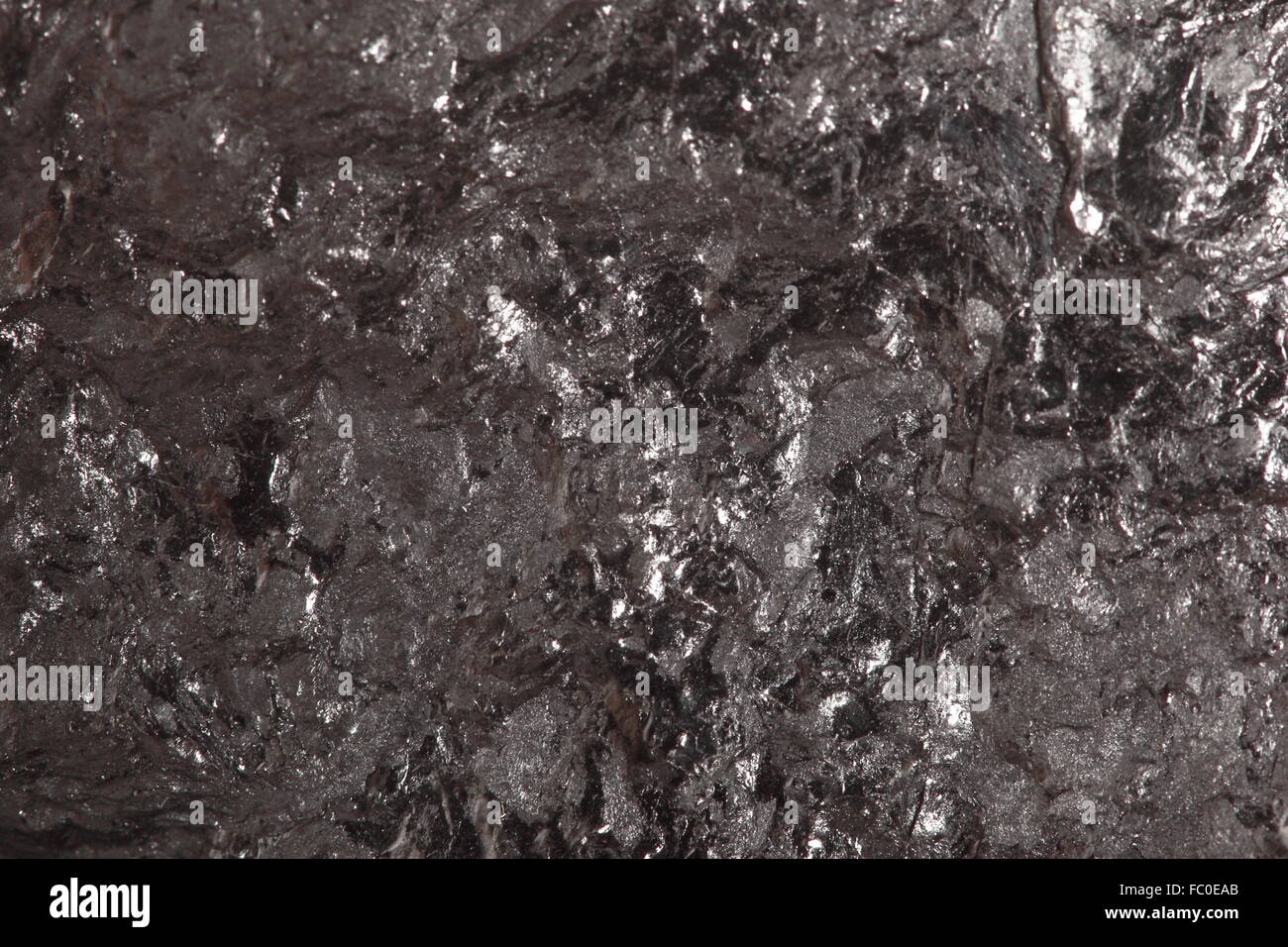 Black bituminous coal, carbon nugget background Stock Photo - Alamy