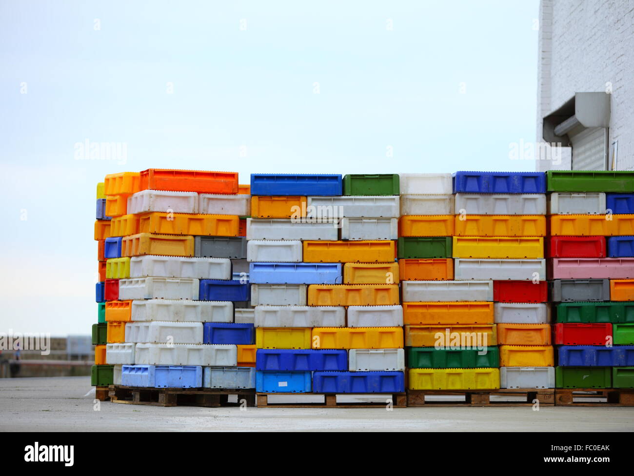 colorful boxes plastic crates containers for fish Stock Photo - Alamy