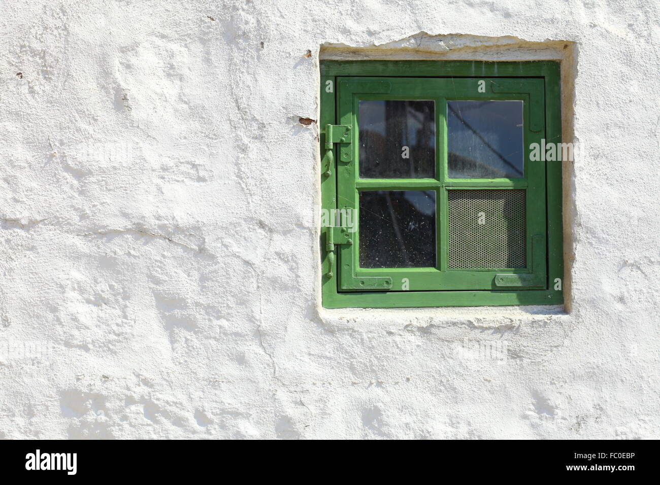 green old window on white wall architecture detail Stock Photo - Alamy