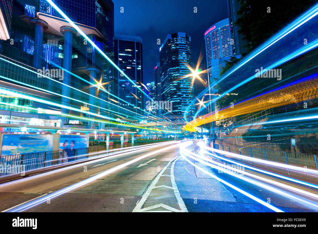 Traffic in between the city at night Stock Photo - Alamy