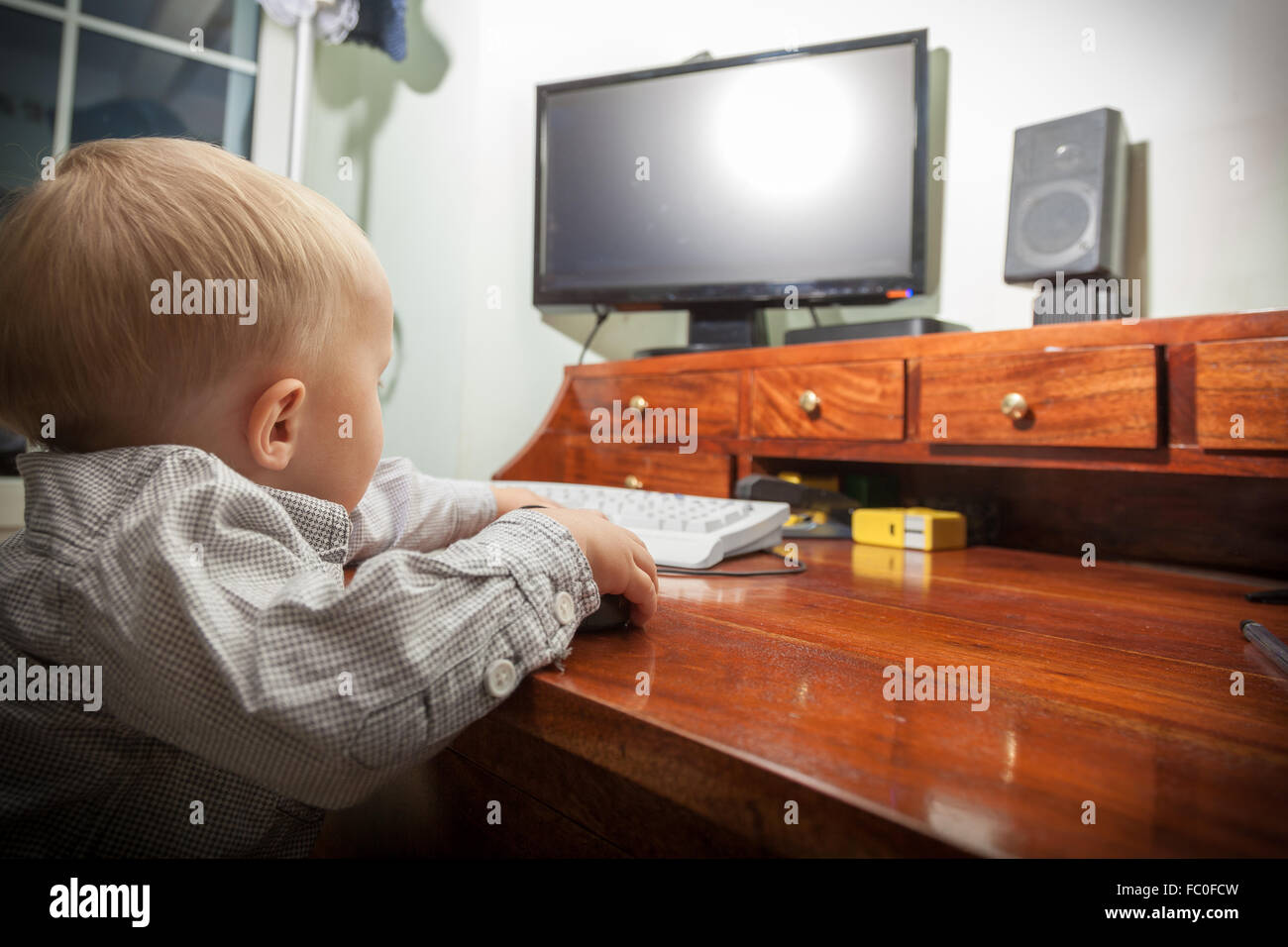 Little boy child kid playing on the computer Stock Photo - Alamy