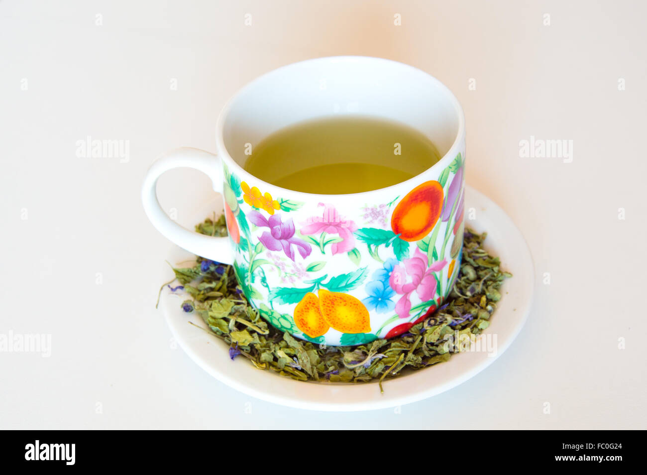 Mallow herbal tea cup on orange background Stock Photo - Alamy