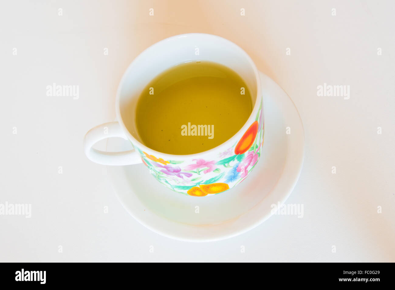 Mallow herbal tea cup on orange background Stock Photo - Alamy