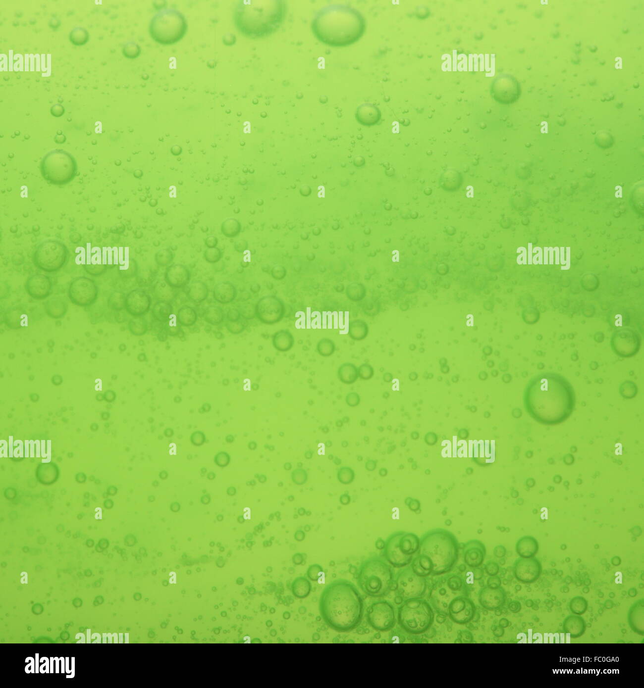 soap bubbles green liquid background Stock Photo - Alamy