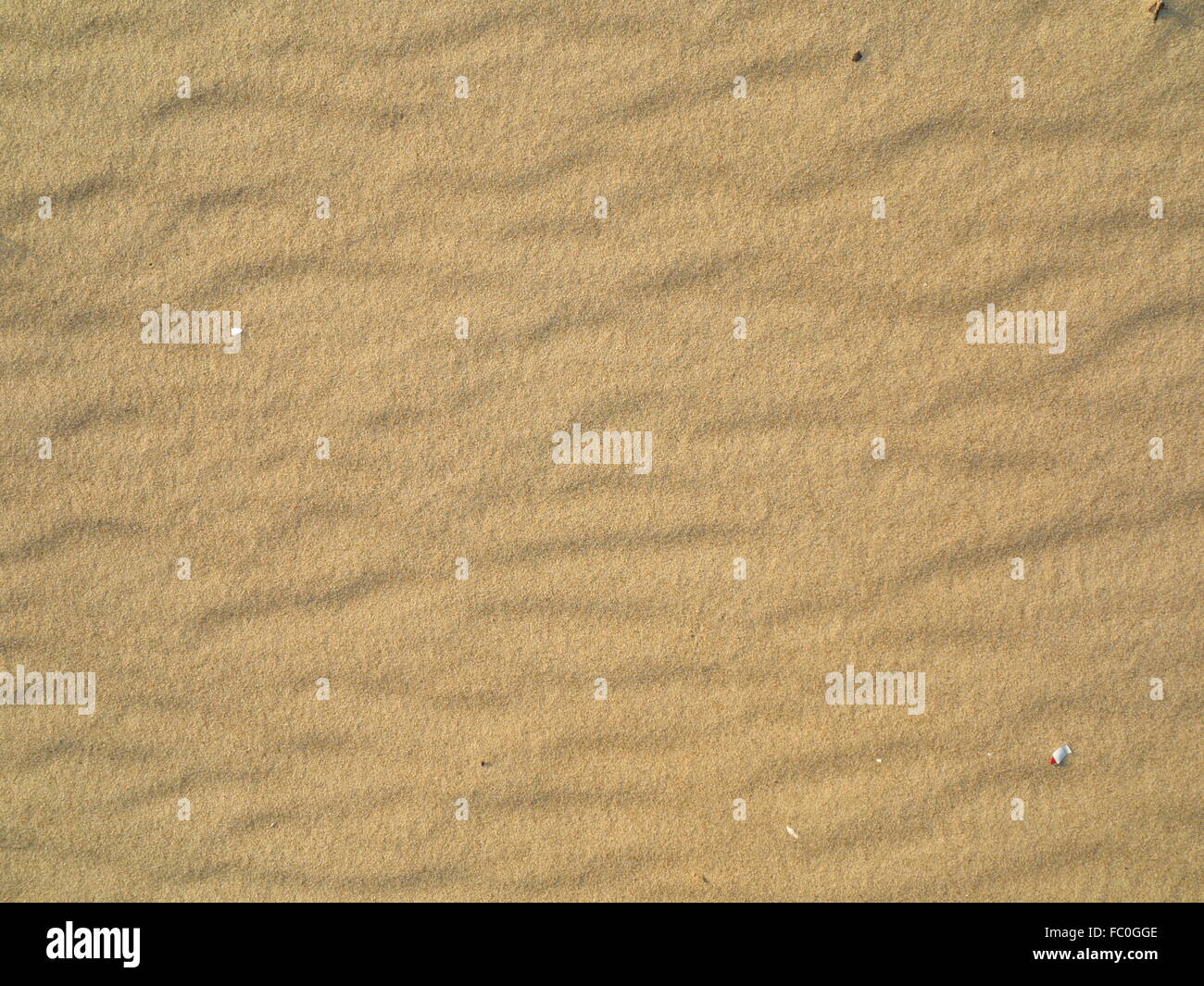wavy yellow sand texture background Stock Photo - Alamy