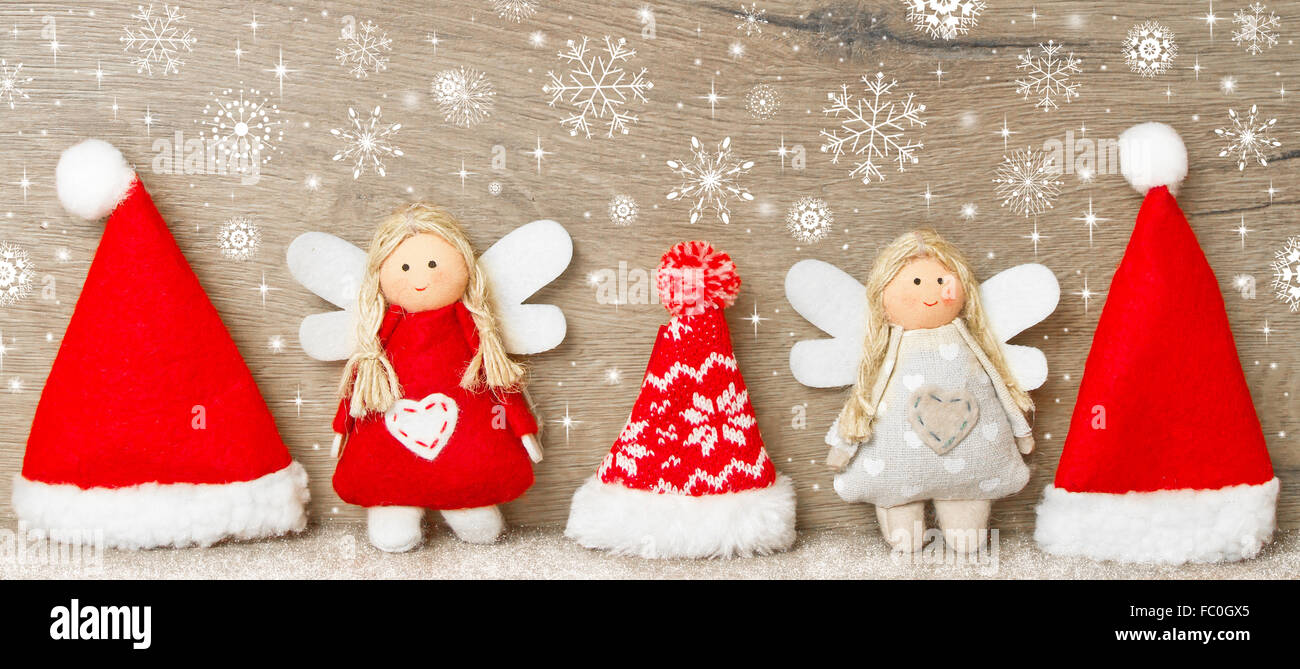 Christmas angles and christmas hats Stock Photo - Alamy