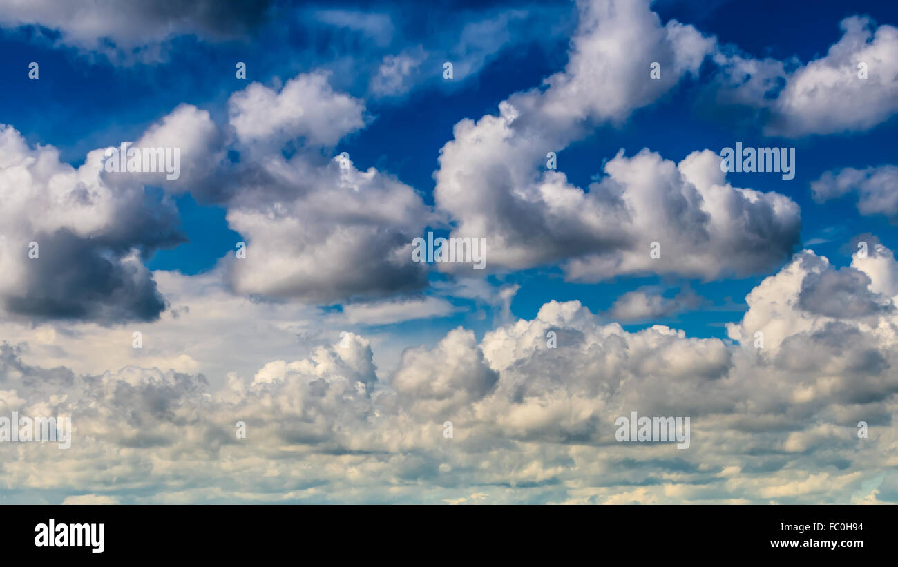 Deep blue sky background with clouds Stock Photo - Alamy