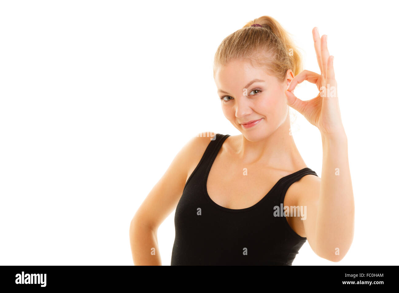 Fitness sporty girl showing ok okay hand sign gesture Stock Photo - Alamy