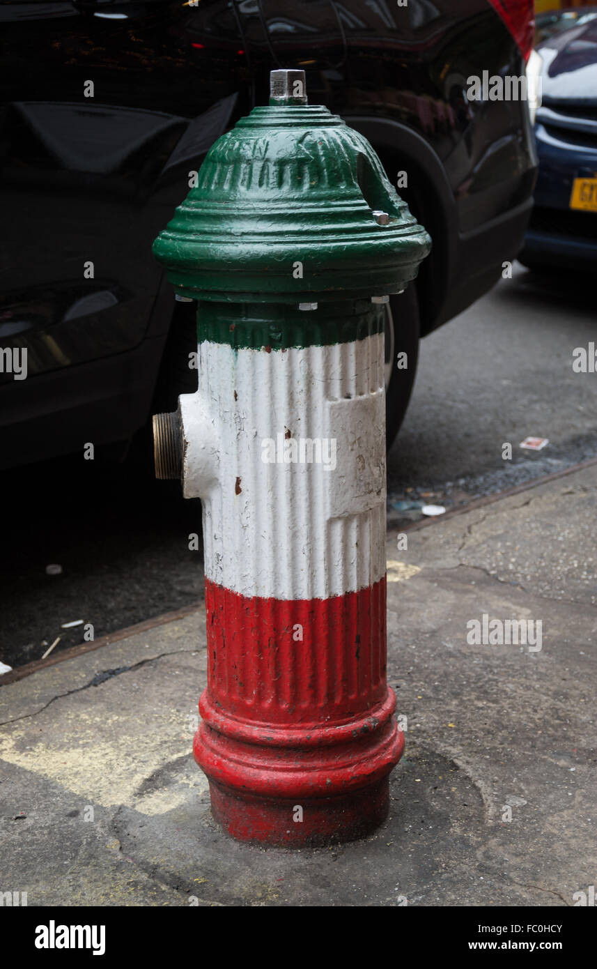 Fire hydrant painted in the colours of the Italian flag (red, white and ...