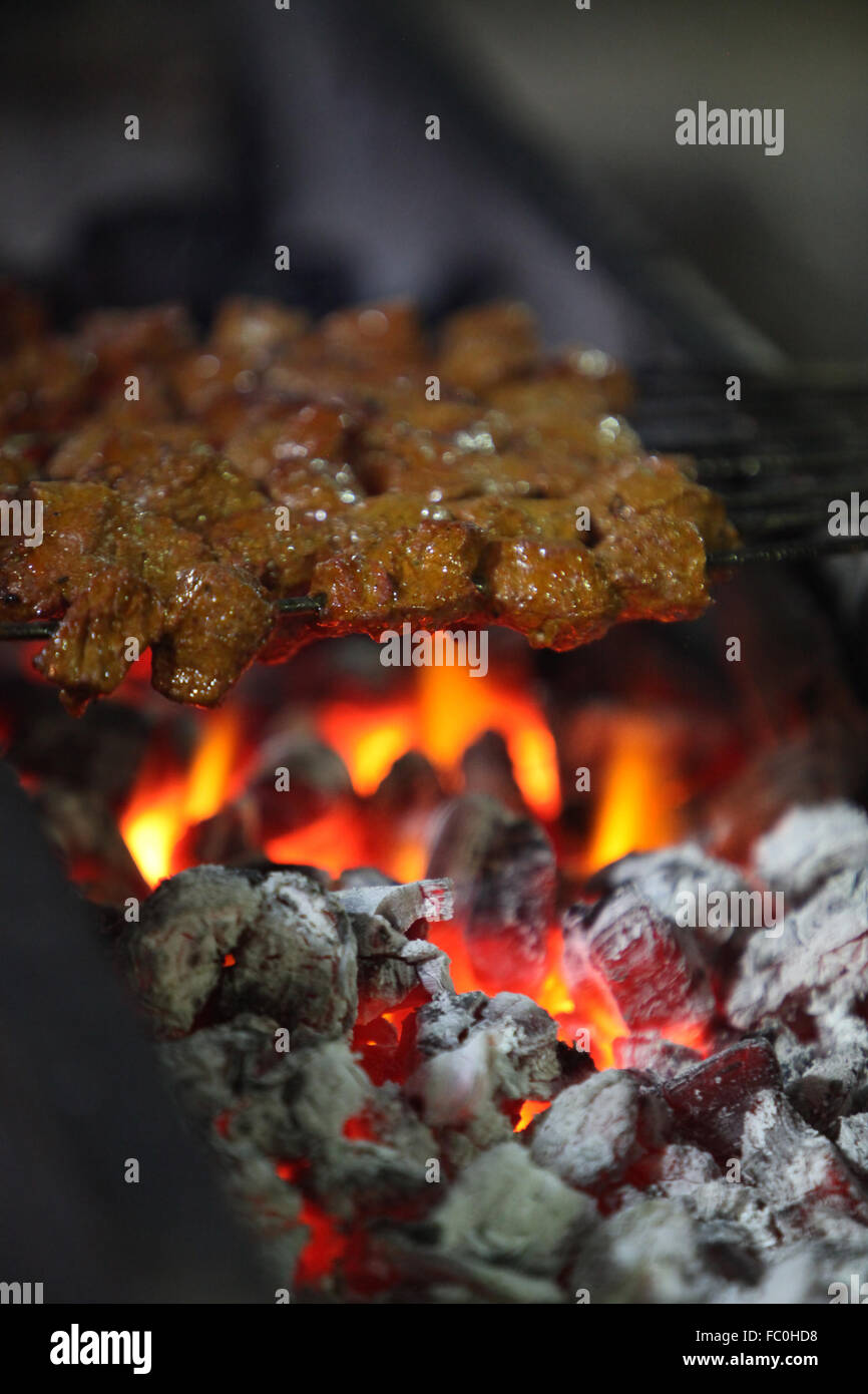 Juicy mutton(lamb) and chicken kebabs being roasted on a barbeque Stock ...