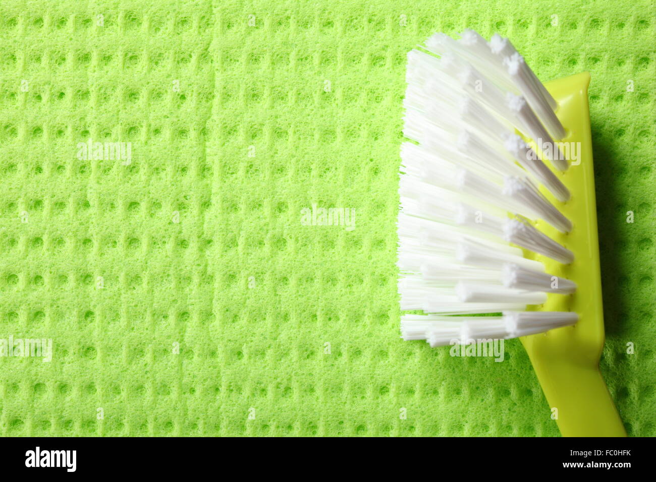 Green sponge background and brush Stock Photo - Alamy