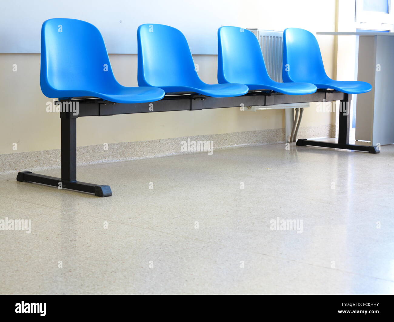 Blue stools in the waiting room Stock Photo - Alamy