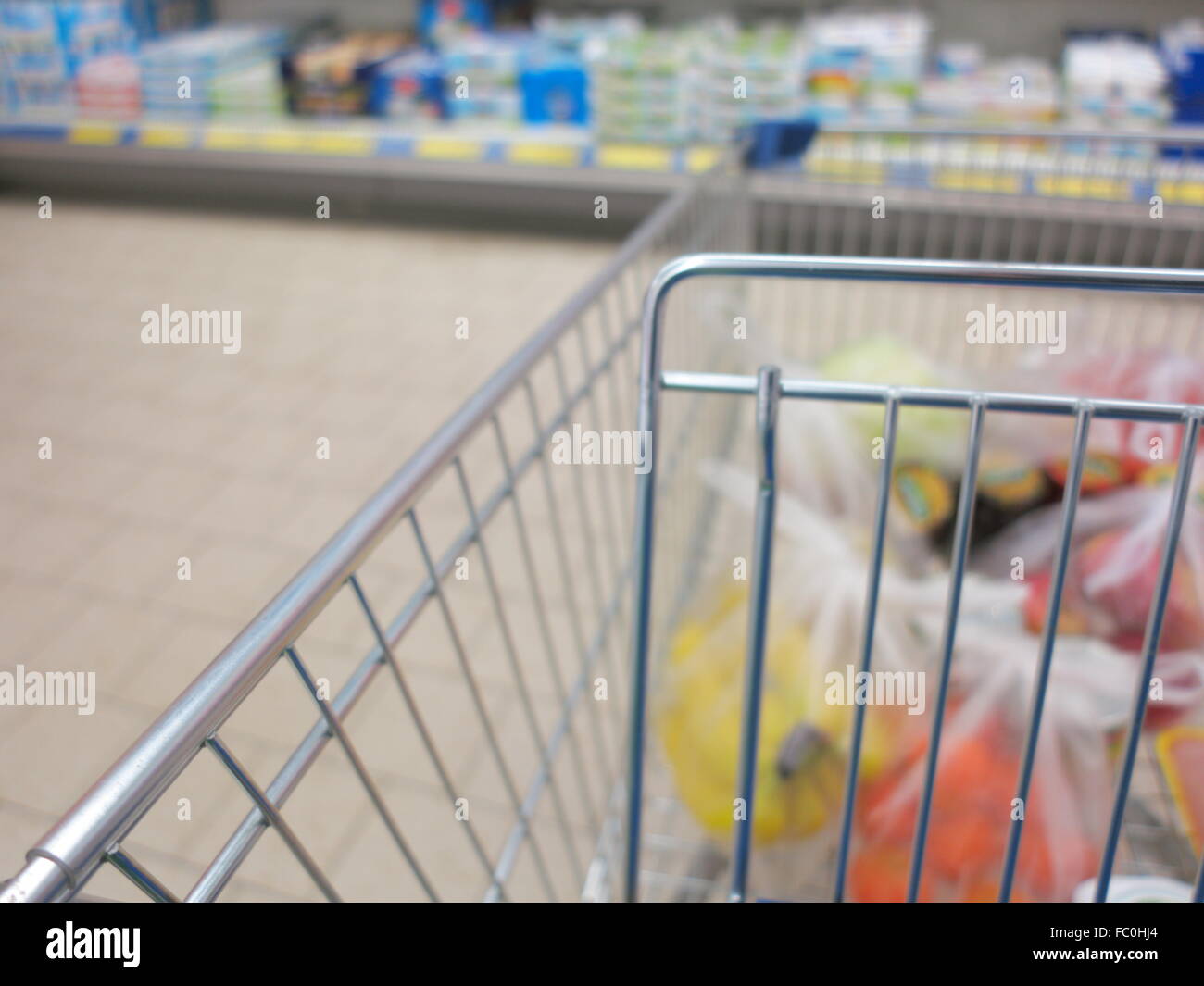 view of a shopping cart with grocery items Stock Photo - Alamy