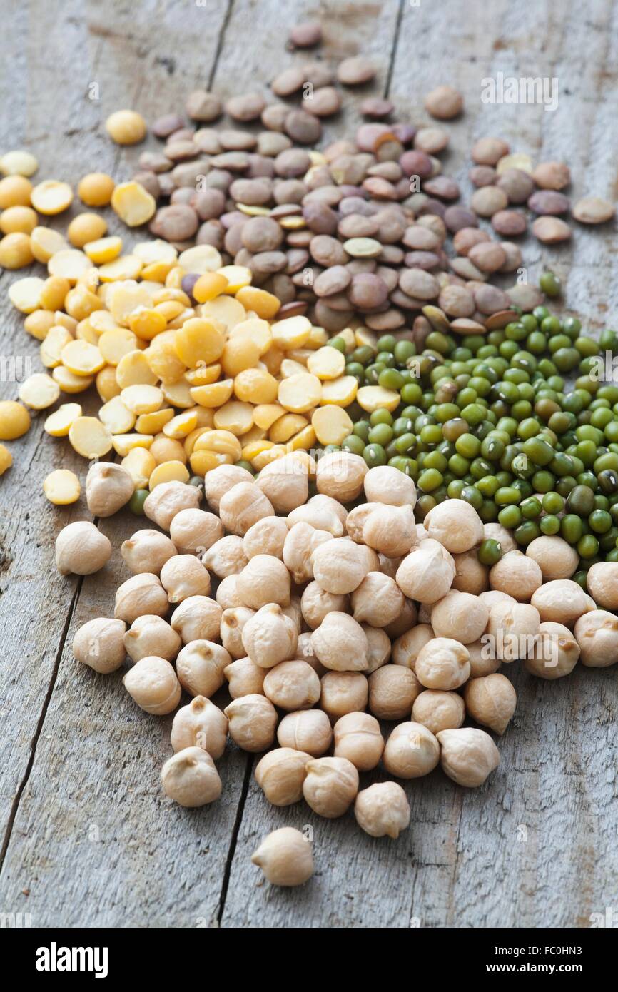 Mung beans, chick peas, green lentils and yellow split lentils on a ...