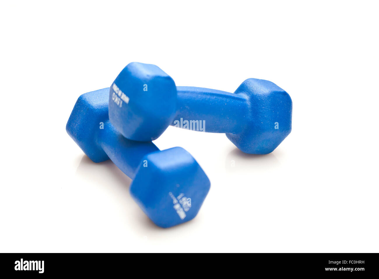 Pair small blue dumbbells isolated on white background Stock Photo - Alamy