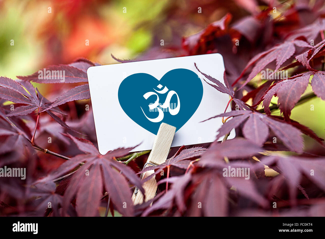 The Om Sign inside a heart Stock Photo - Alamy