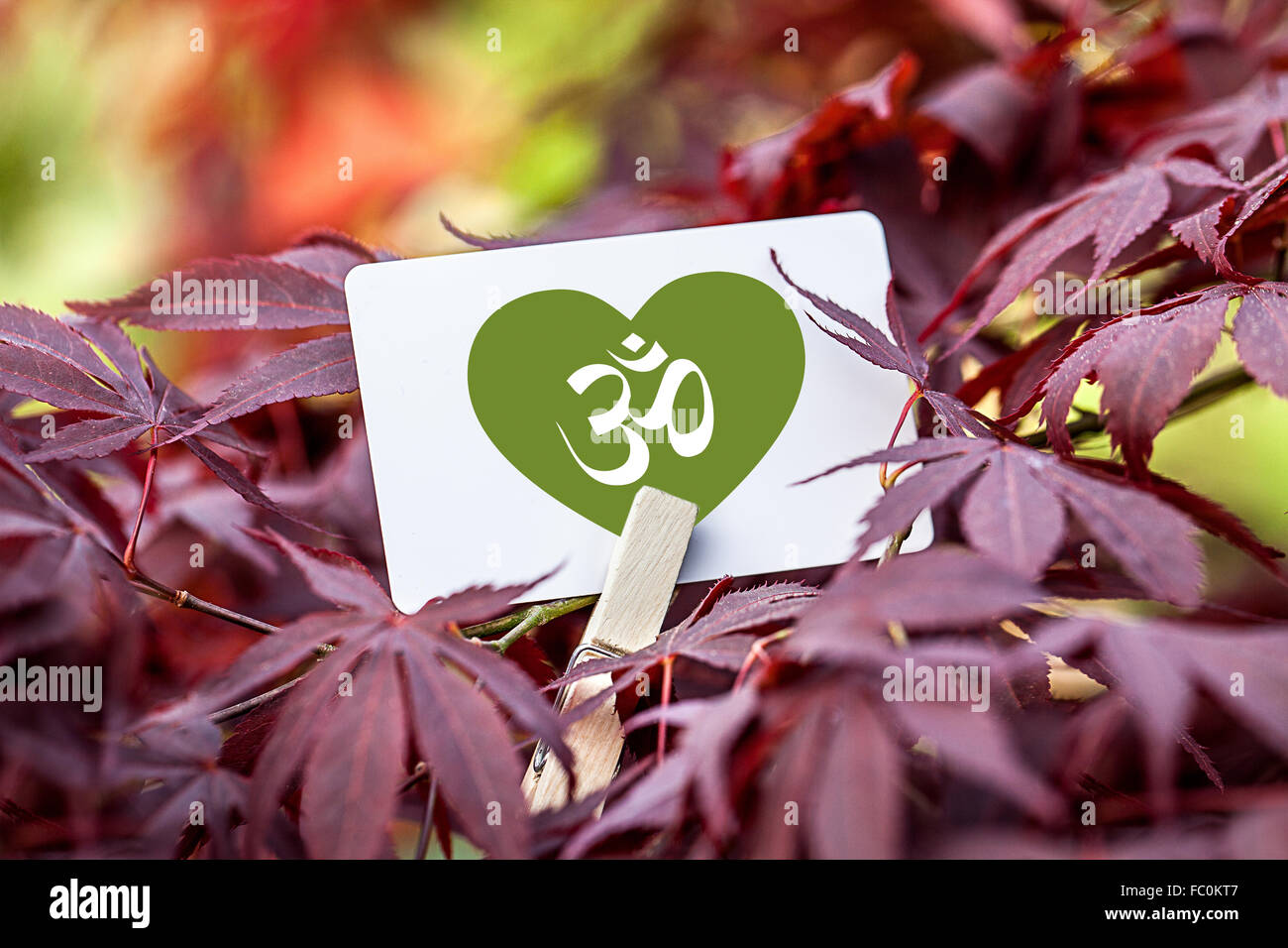 The Om Sign inside a heart Stock Photo - Alamy