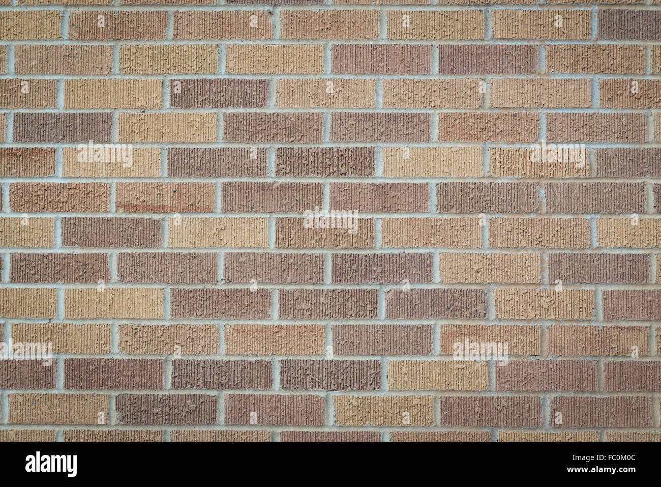 background of random orange green tone brick wall, pattern, close up ...