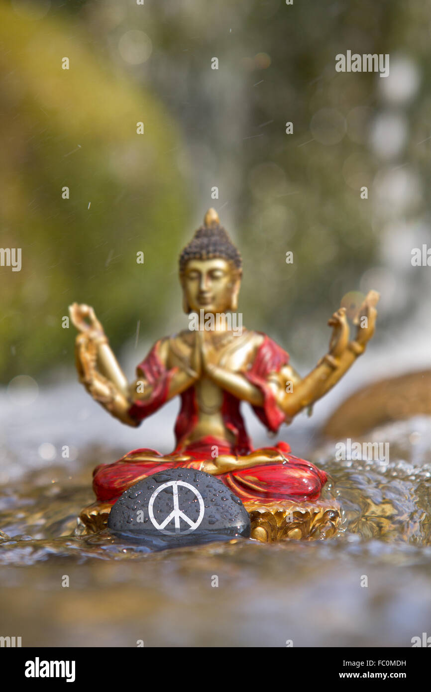 Buddha statue with the Peace Sign Stock Photo - Alamy