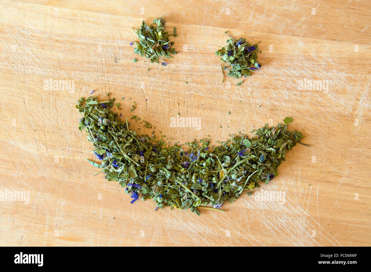Happy smile of mallow herbal tea isolated closeup on wood Stock Photo ...
