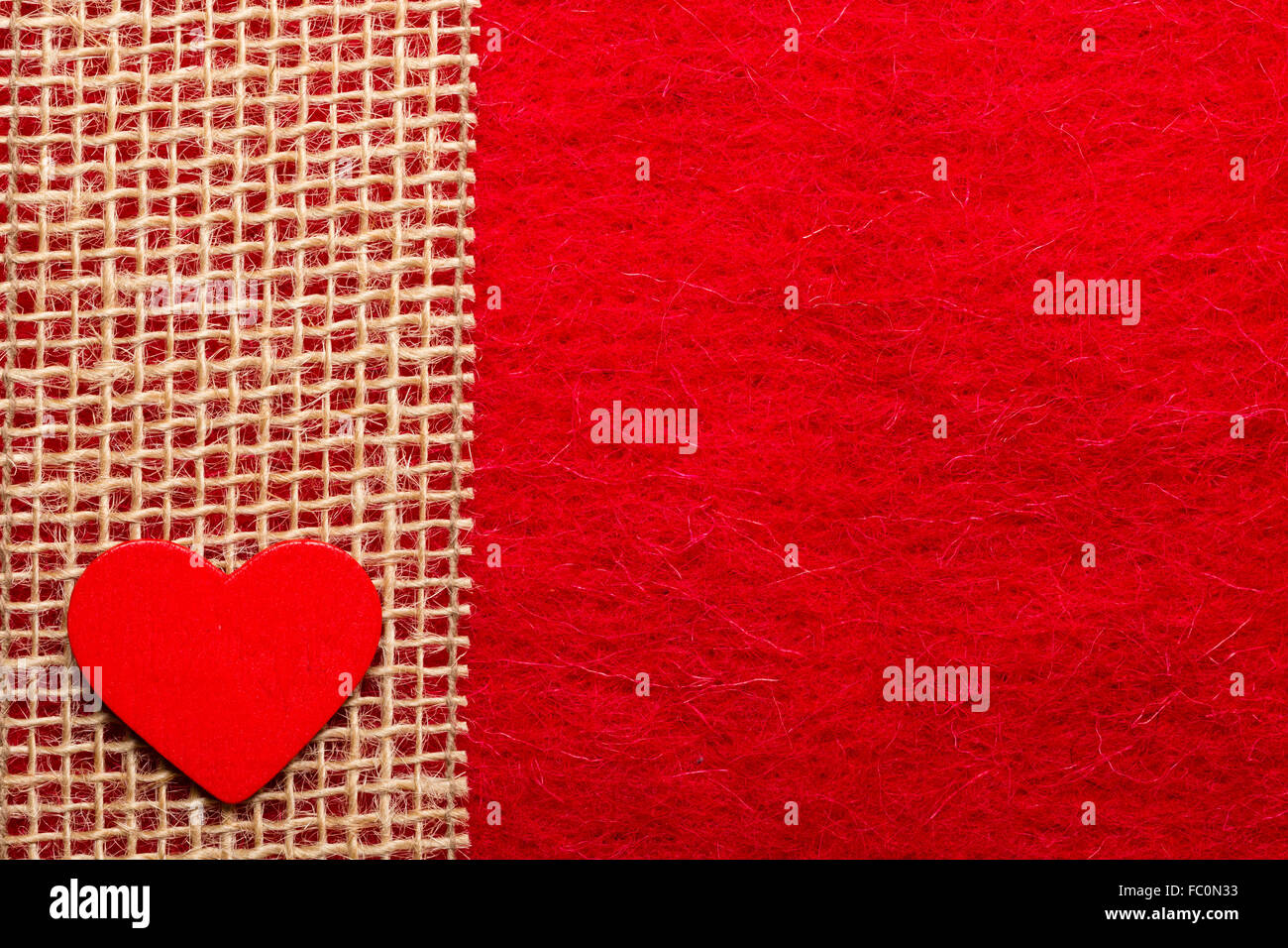 heart on red cloth background Stock Photo - Alamy
