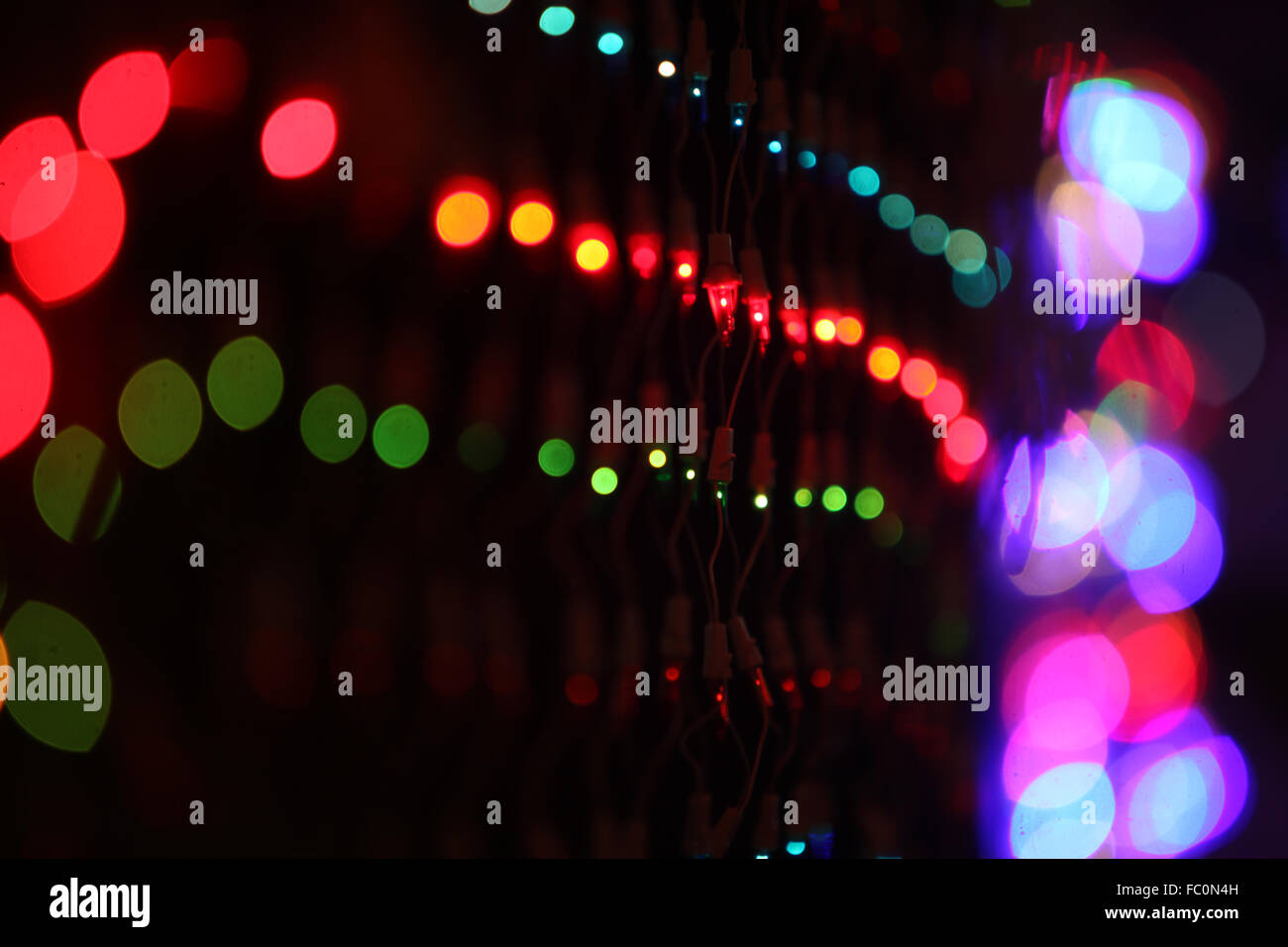 A background with a view of colorful wire mesh, on the backdrop of blur ...