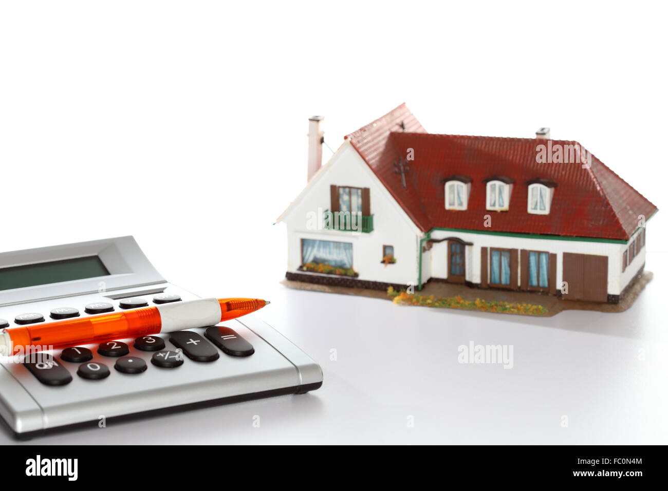 pen home and calculator Stock Photo - Alamy