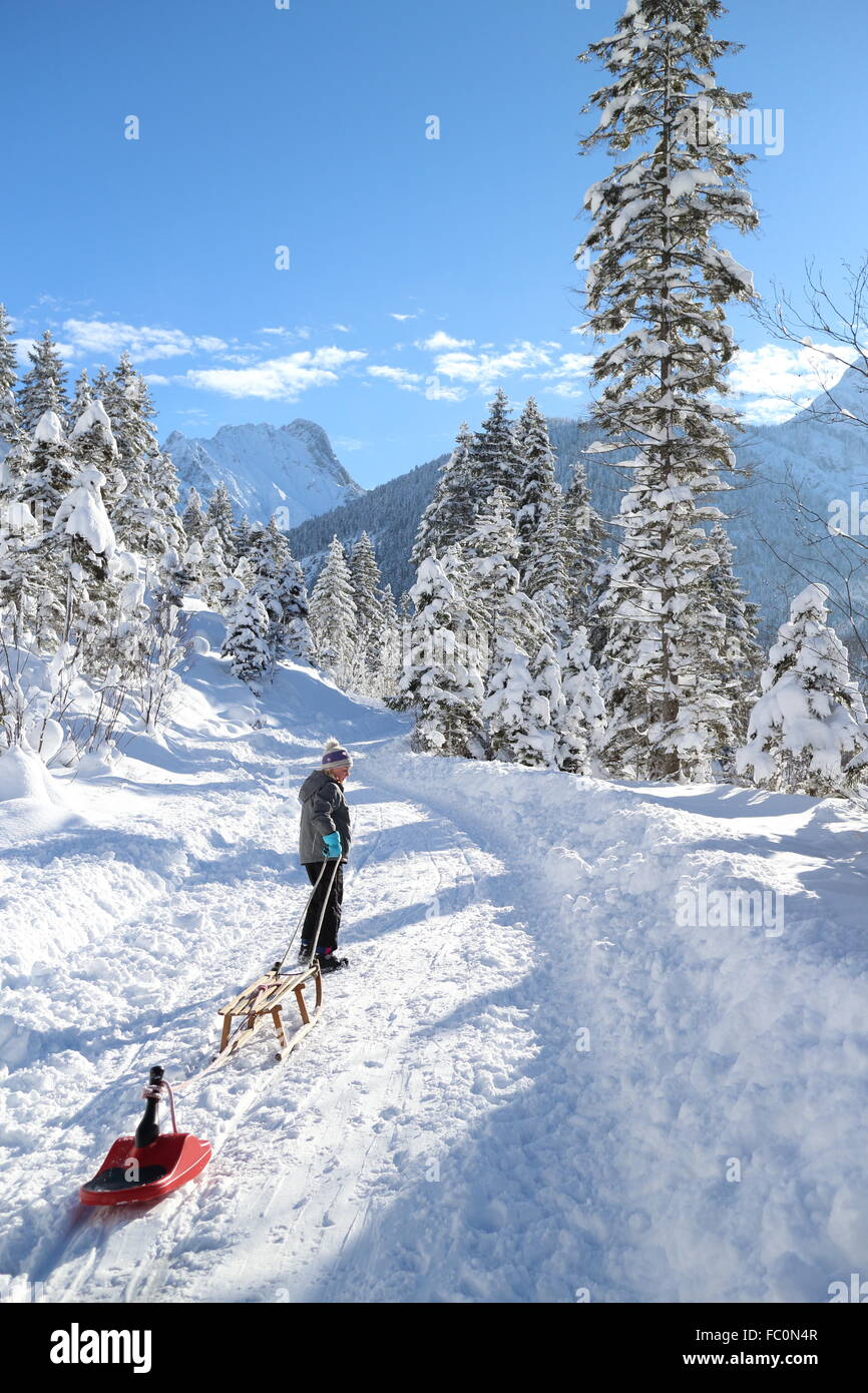 young girl with sledge Stock Photo - Alamy