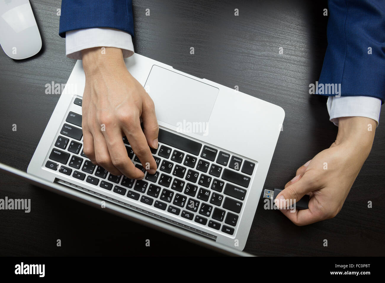 man in suit working in office desk, plug in flash drive, top view Stock ...