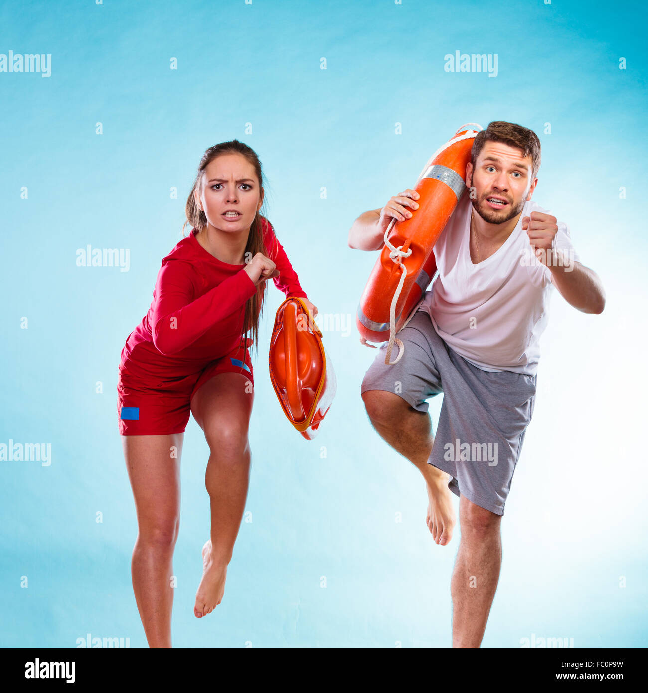 lifeguards running with equipment Stock Photo - Alamy