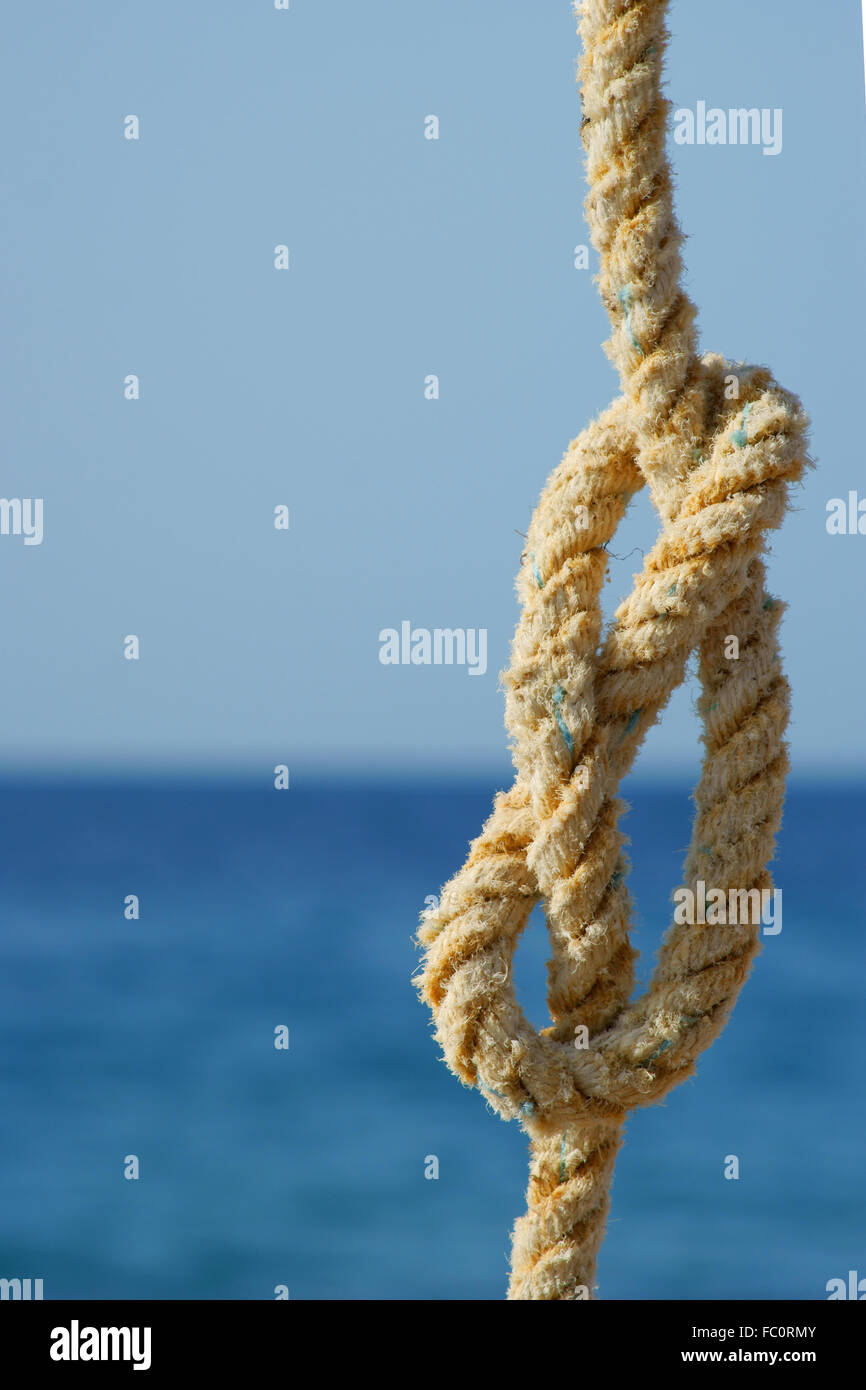 rope with a knot - sea background Stock Photo - Alamy