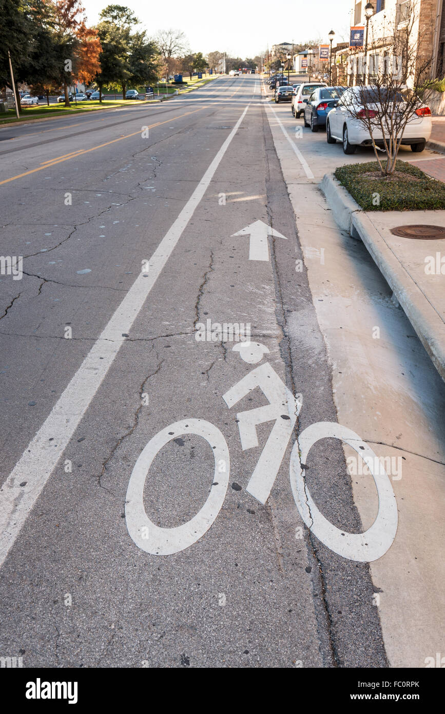 bicycle sign on a bicycle lane with arrow of direction Stock Photo - Alamy