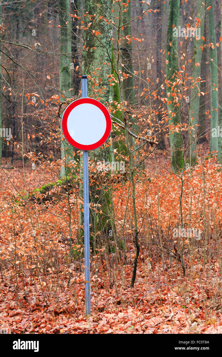 No vehicles traffic sign in forest Stock Photo - Alamy
