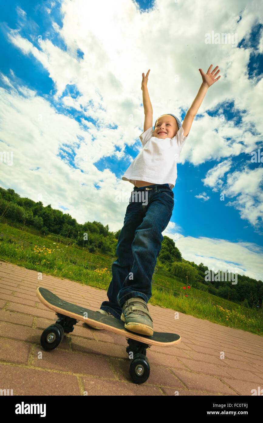Skater boy child with his skateboard. Outdoor activity Stock Photo - Alamy